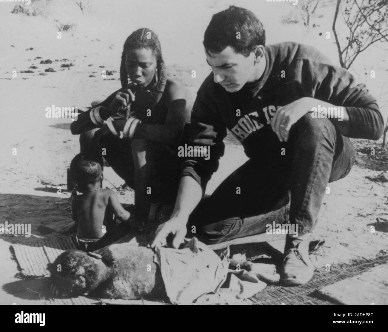 Smallpox. Health worker examines a child affected by a severe smallpox ...