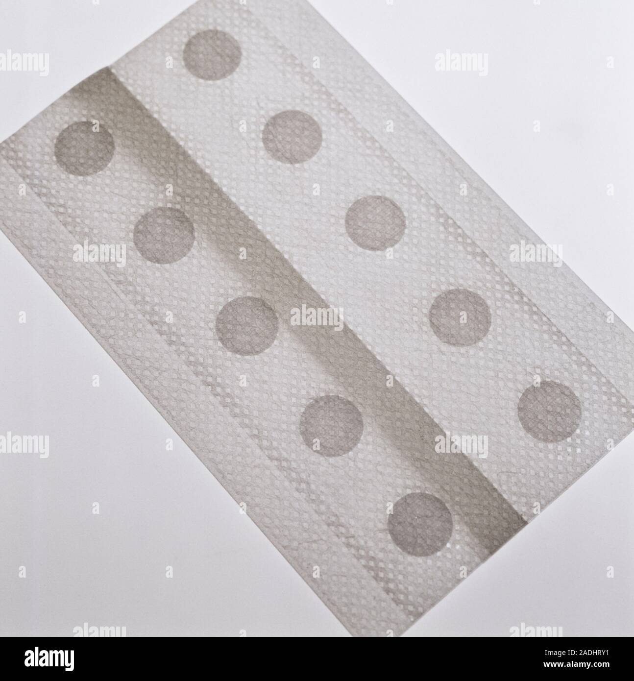 Allergy patch test. Tissue paper with ten patches (round) to be used in ...