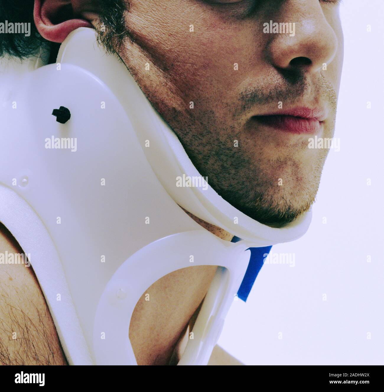 Neck brace being worn by a man to provide support and pain relief from ...