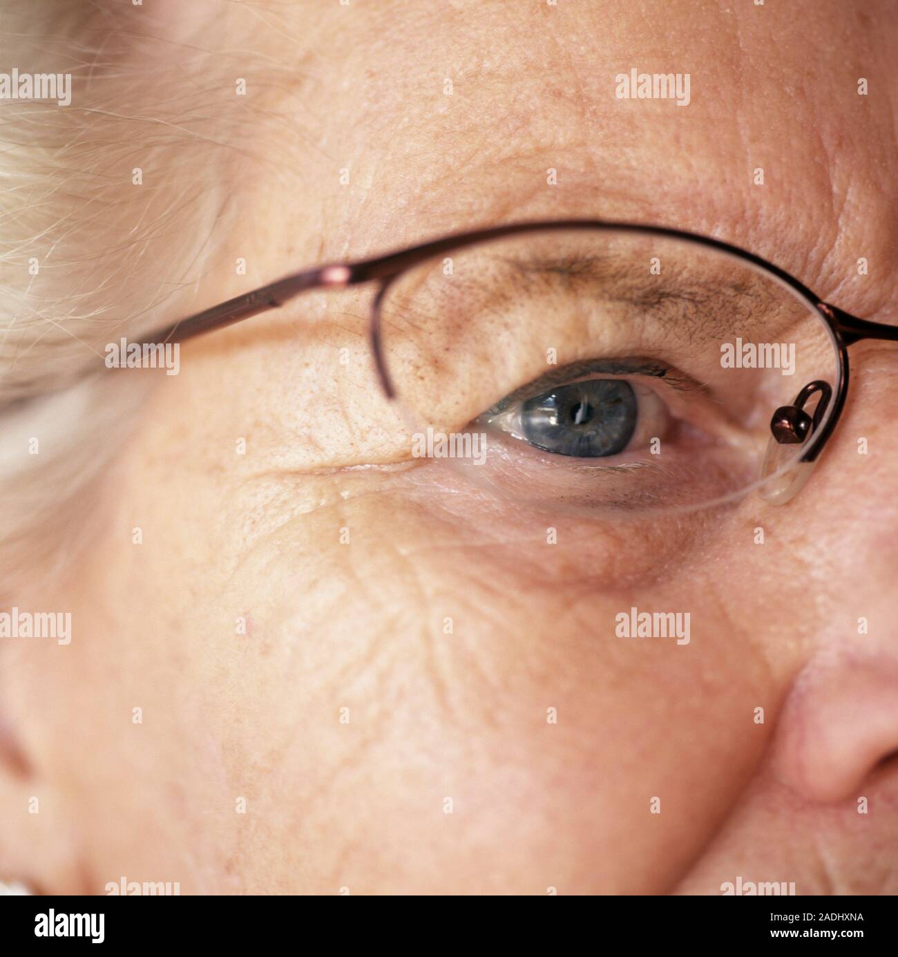 Elderly woman wearing glasses Stock Photo - Alamy