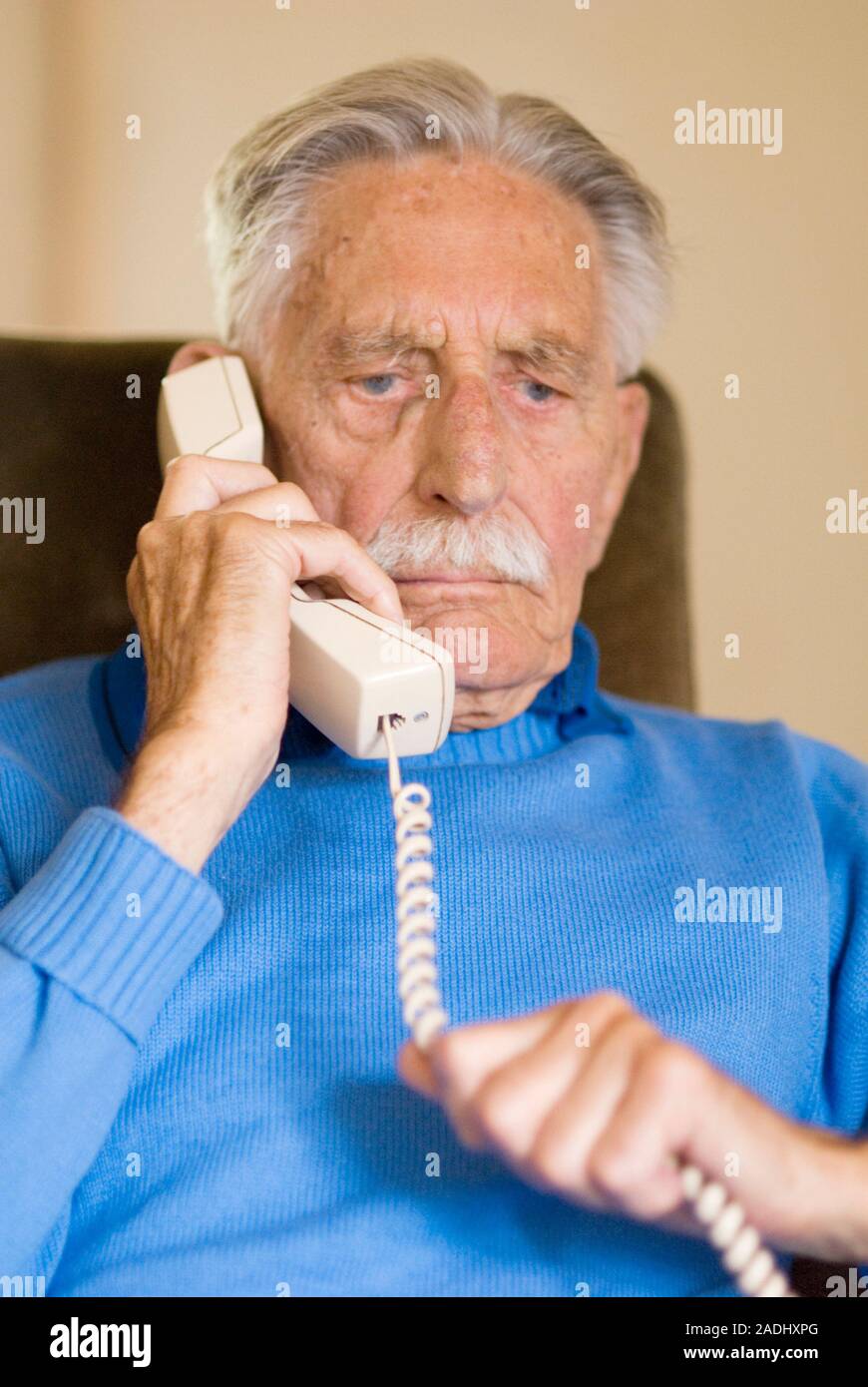 Elderly man using a telephone Stock Photo - Alamy