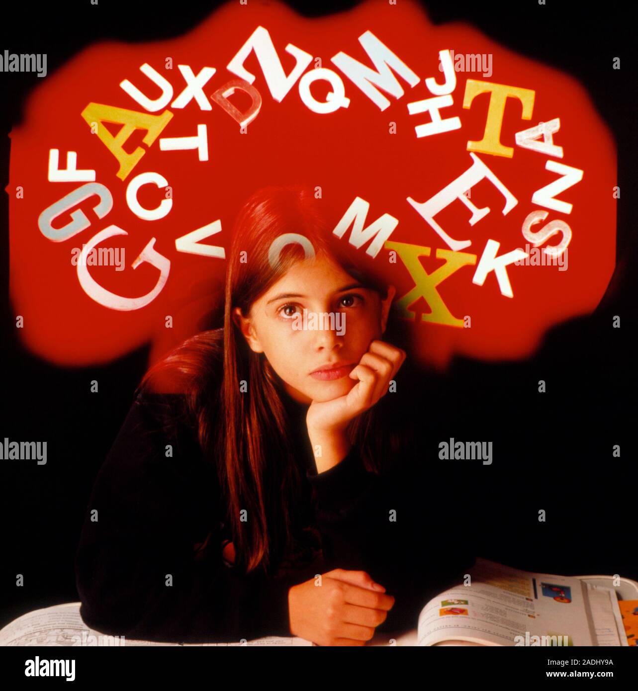 Dyslexia. Abstract image of a dyslexic girl sitting with a book ...