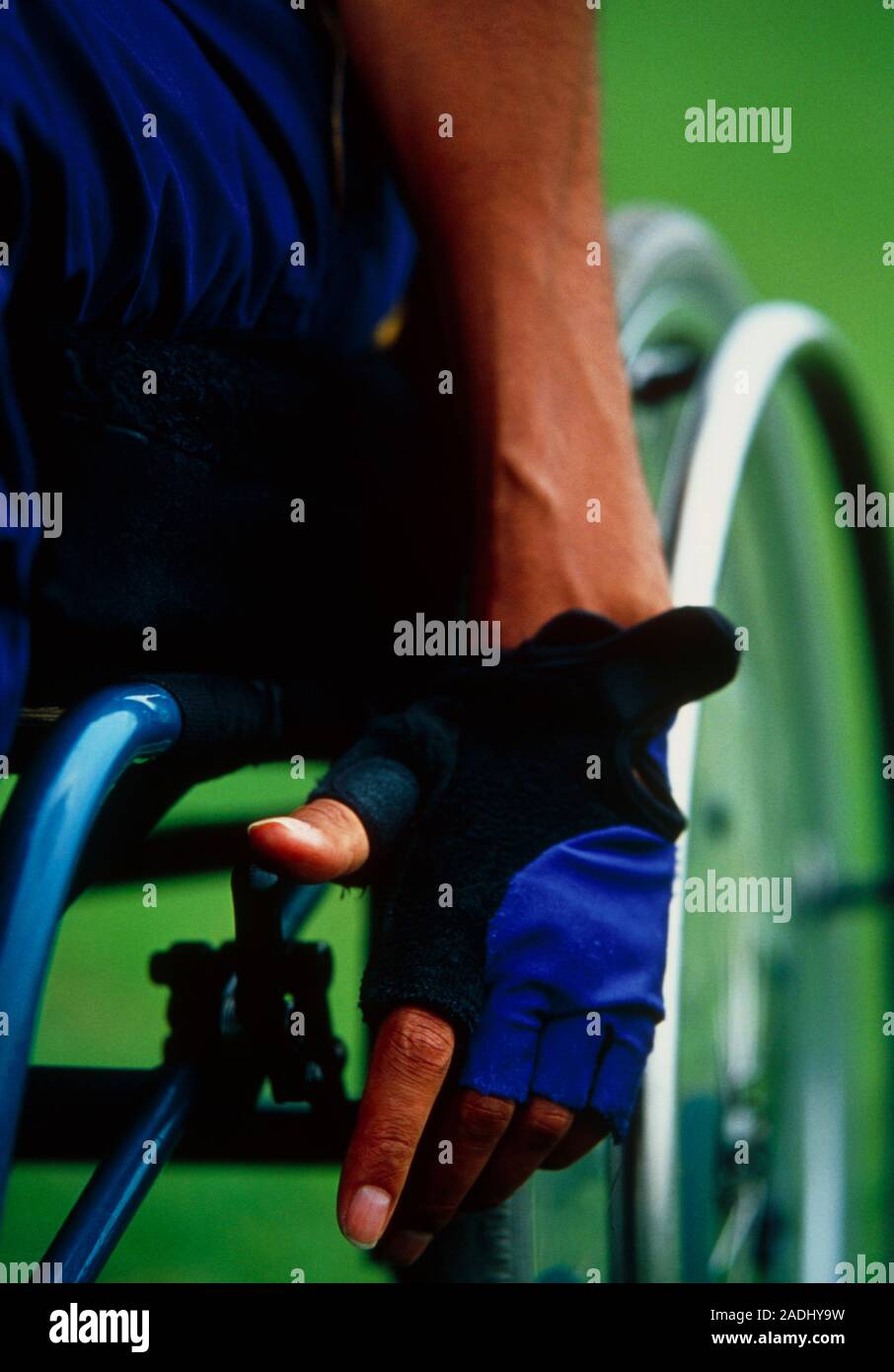 Disabled man. Gloved hand of a man operates a wheelchair Stock Photo ...