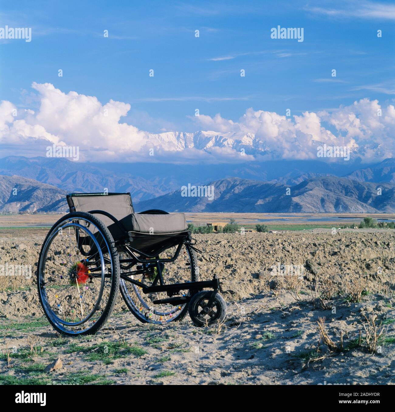 Wheelchair design. Three-wheel wheelchair in rural Afghanistan. This ...