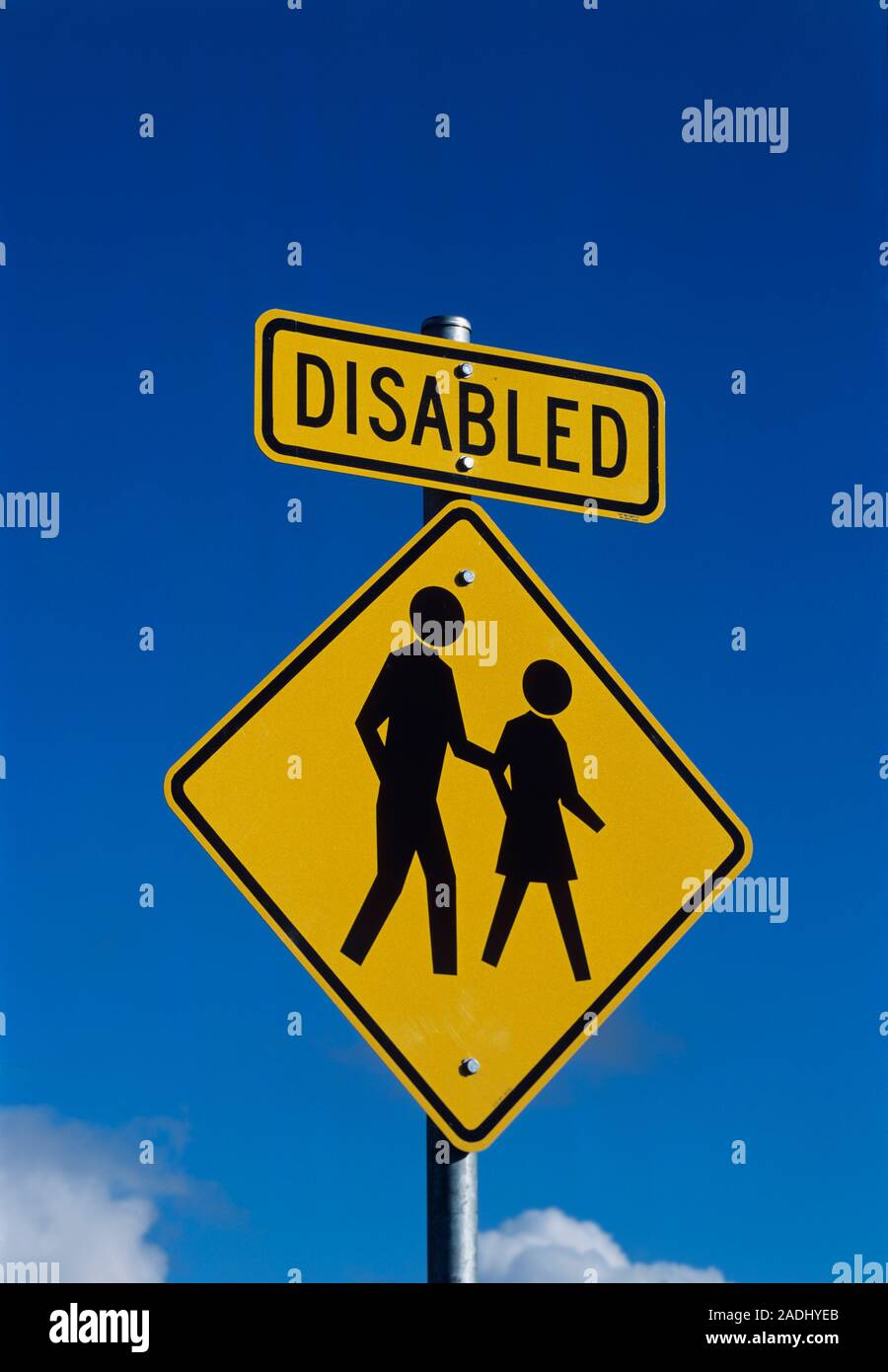 Disability road sign. Road sign warning motorists to be careful due to ...