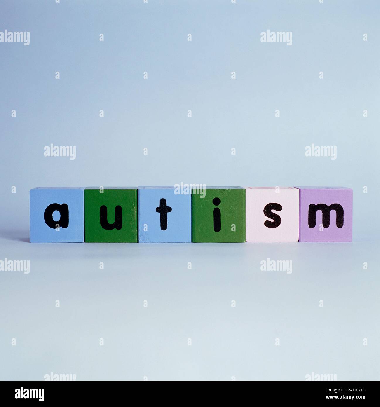 Autism spelled out using alphabet blocks. Autism is a condition in ...