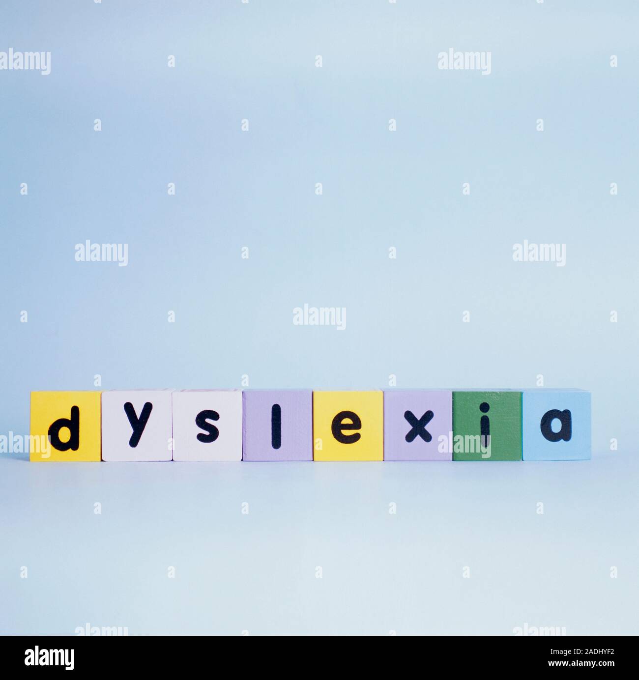 Dyslexia. The word 'dyslexia' spelled out using letter blocks. People ...