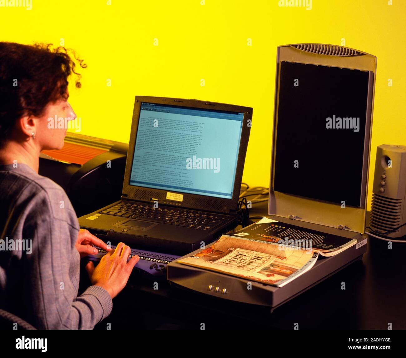 Electronic braille system. Blind woman reading braille, from a system ...