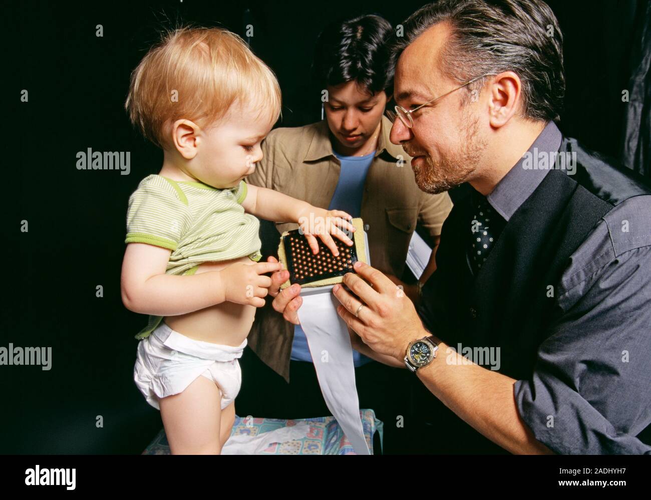 Tactile vision substitution system (TVSS). Scientist giving the TVSS ...