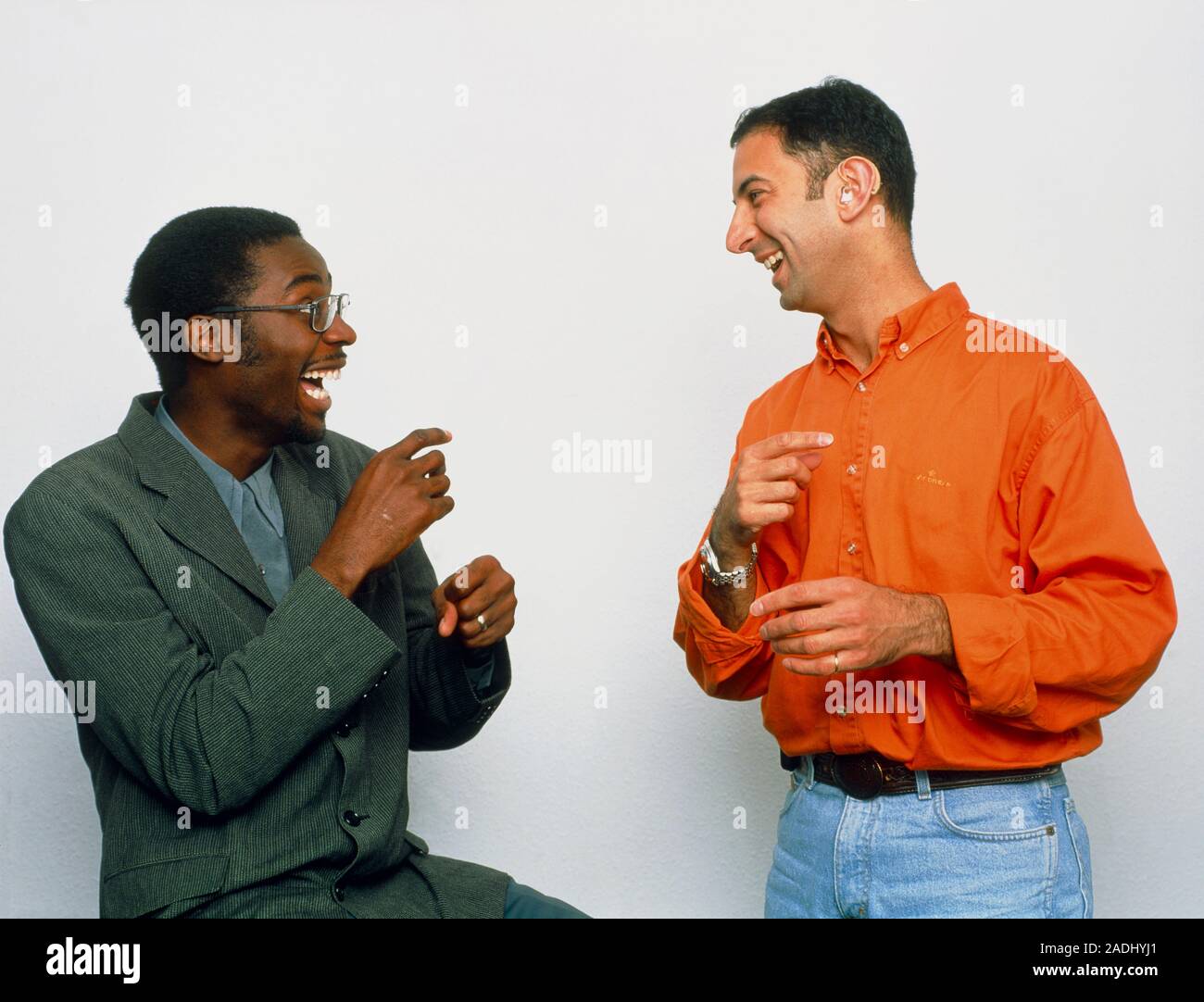 Sign language. Two deaf men using sign language. Each sign, made up of ...