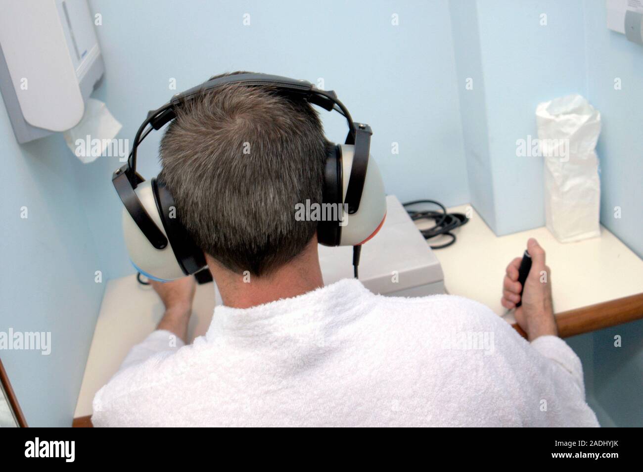 Hearing test. 45-year-old man who is having his hearing tested. The ...