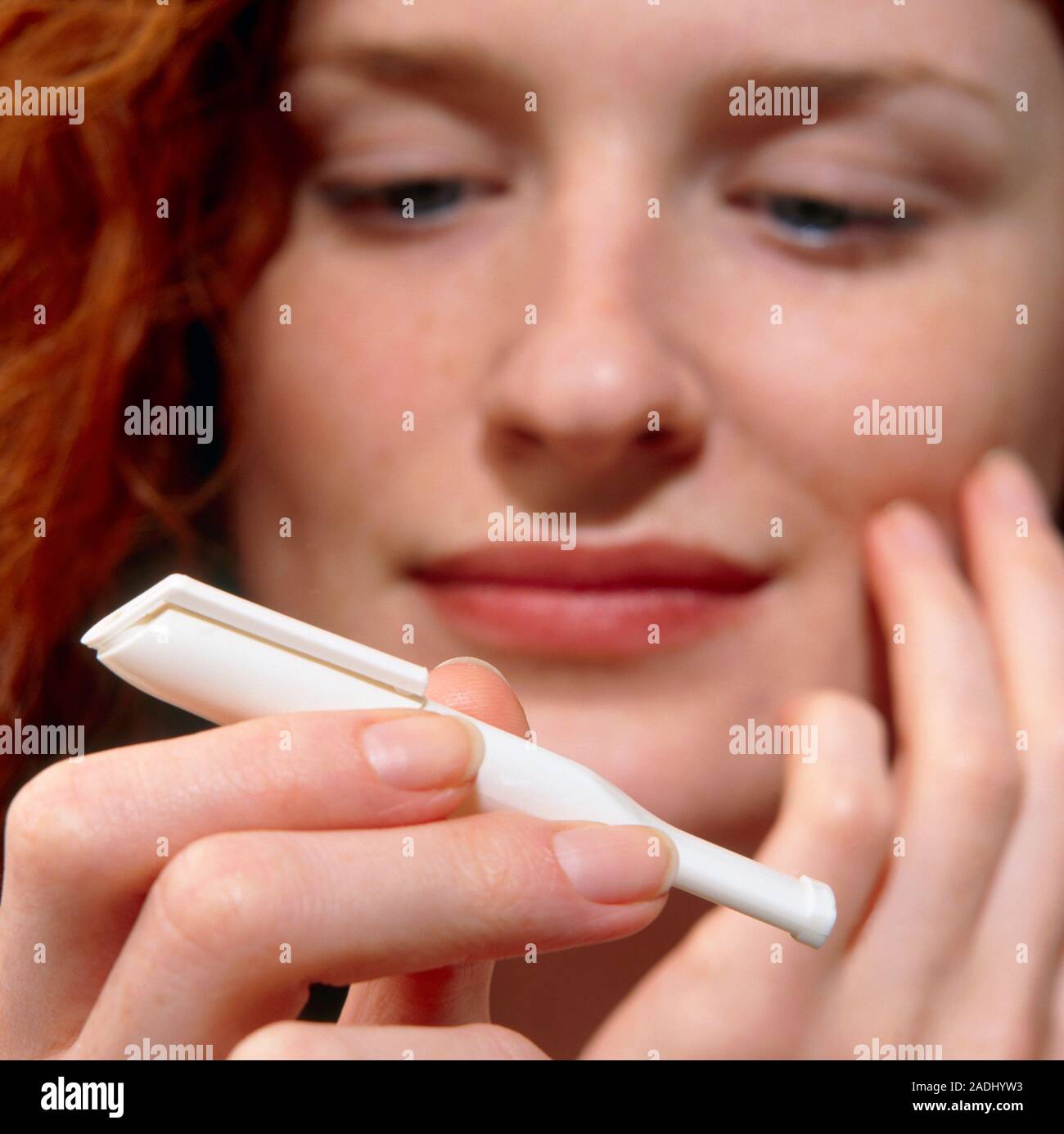 Nicotine inhaler. Woman holds a Nicorette nicotine drug inhaler. This ...