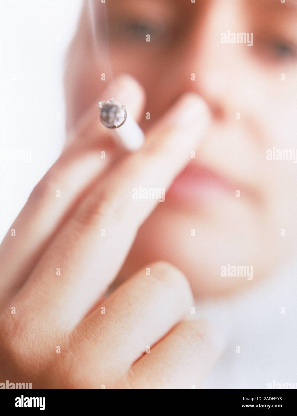 Cigarette smoking. Face of a woman smoking a cigarette. Tobacco ...