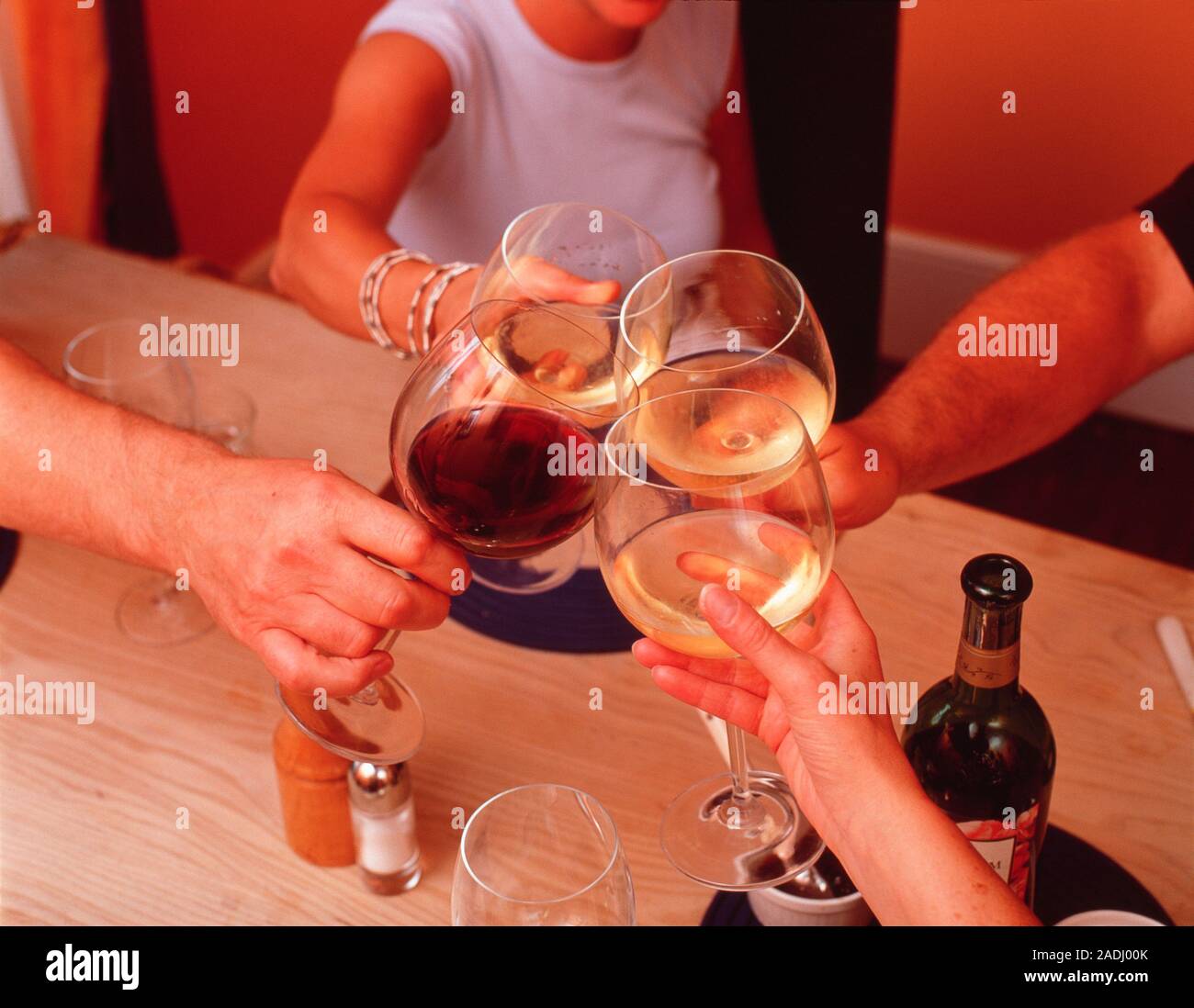 Toast. Hands raising wine glasses in a celebratory toast Stock Photo ...