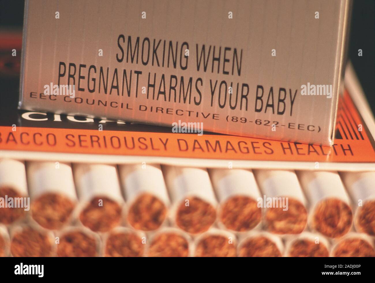 Cigarettes in a packet showing a warning about the damage to unborn ...