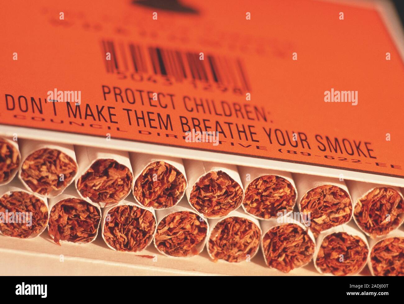 Cigarettes in a packet showing a warning about the damage caused to ...