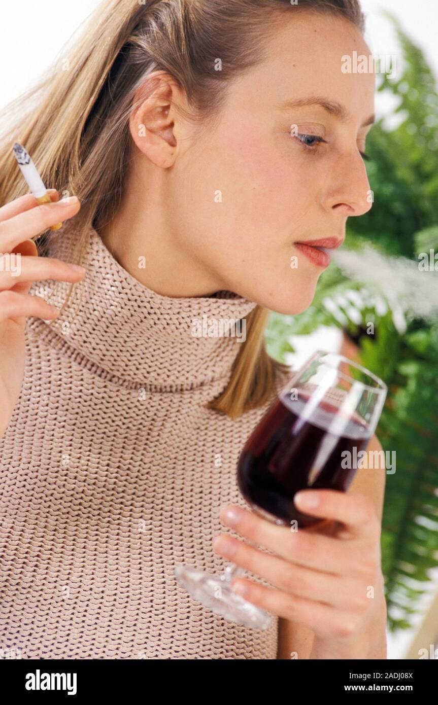 Woman smoking and drinking red wine Stock Photo - Alamy