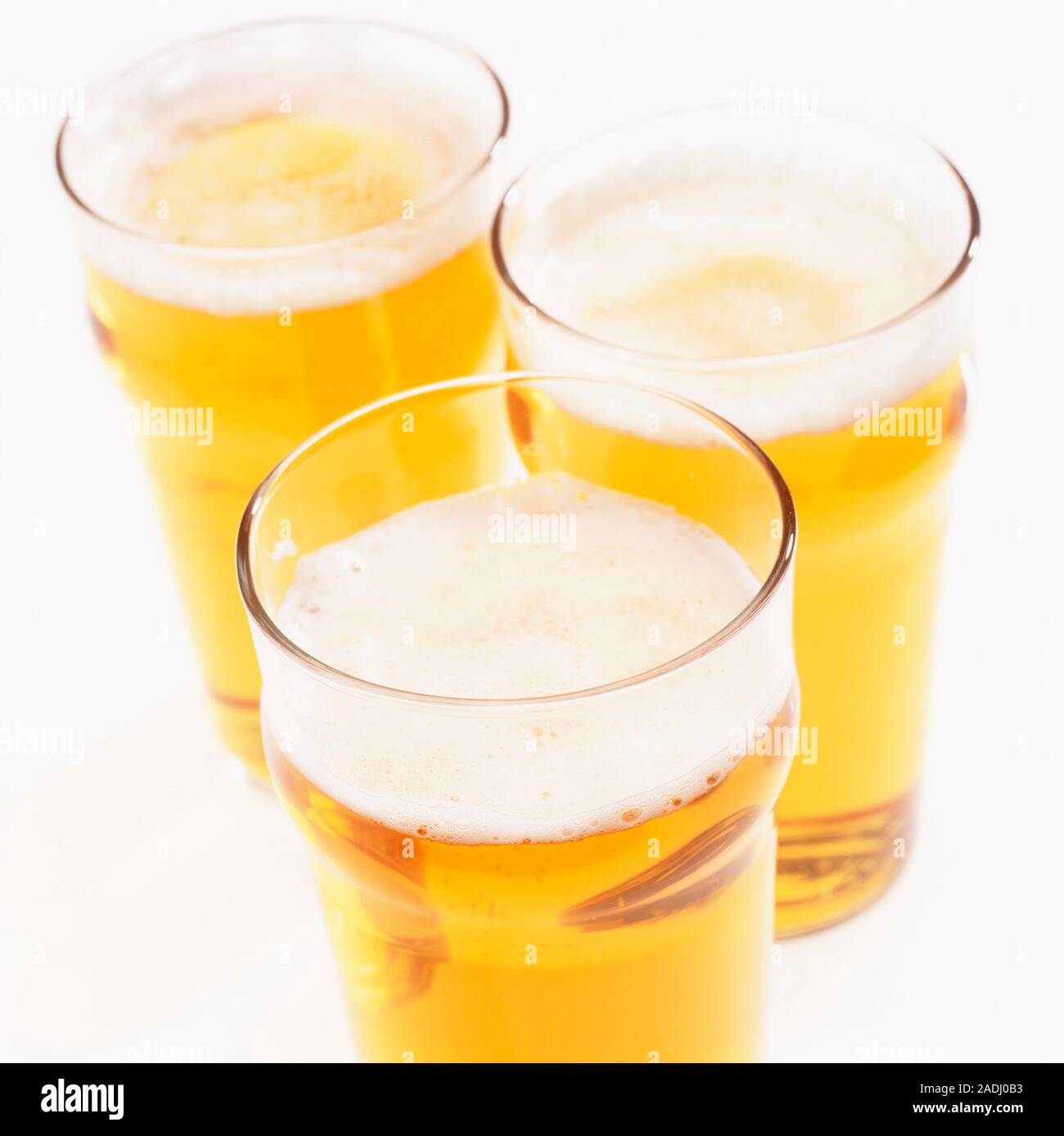 Lager. Three pint glasses filled with lager Stock Photo - Alamy