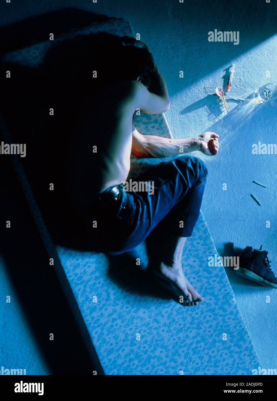 Model released. Heroin addiction: a young man in narcotic sleep after ...