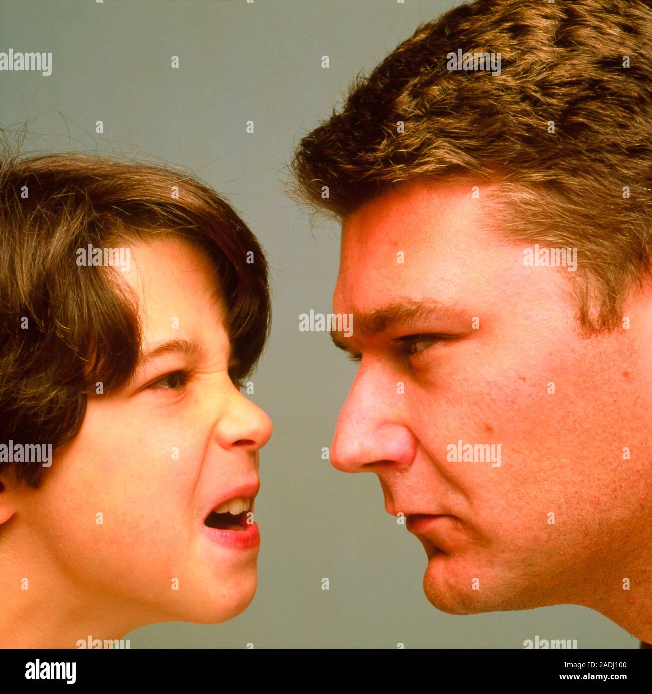 Father-son arguement. Close-up of the face of an emotional young boy ...