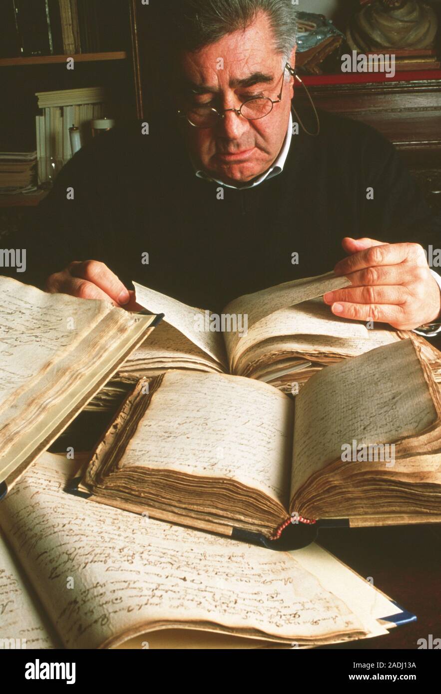 Family tree. Man researching his family tree in church records Stock ...