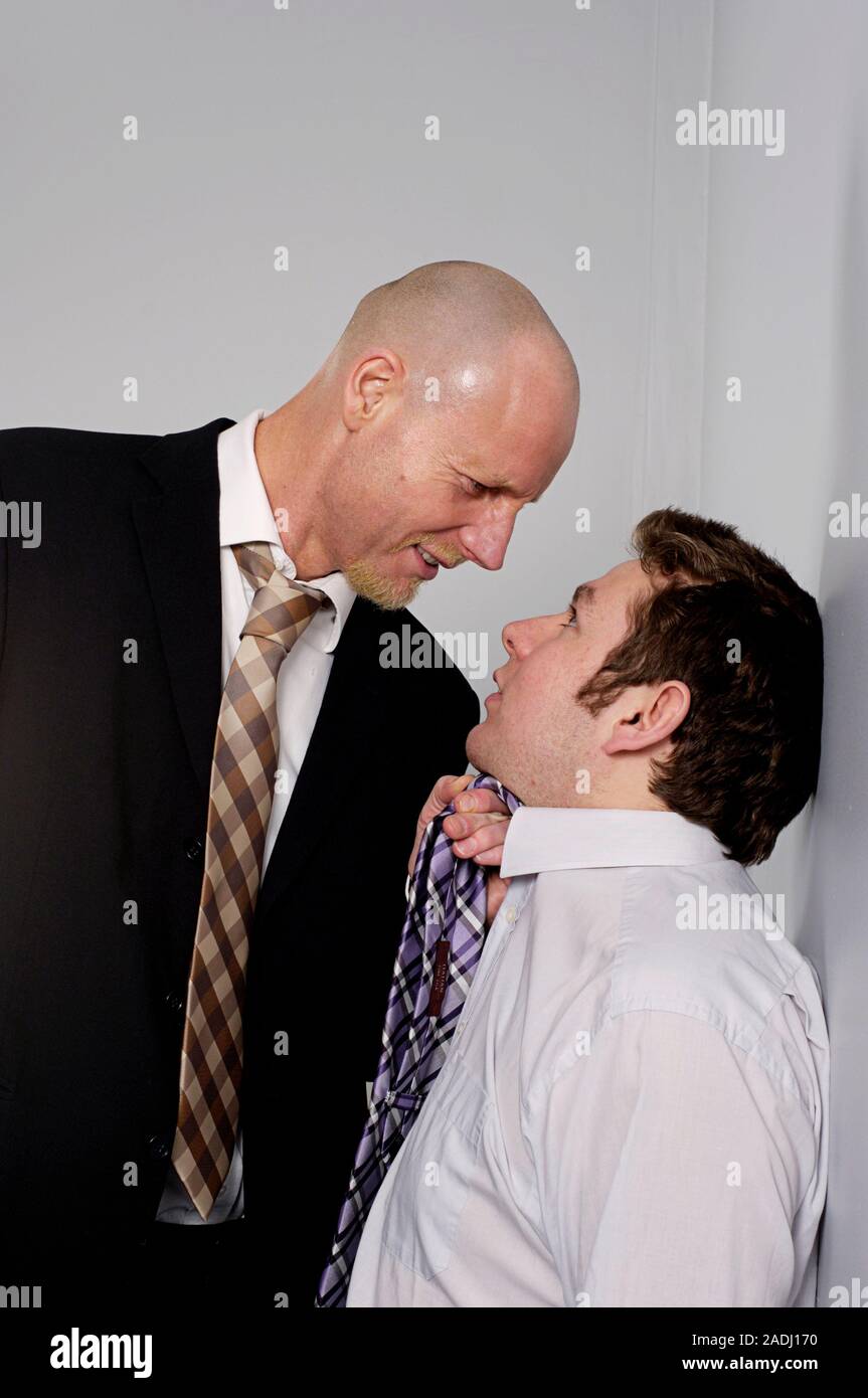 MODEL RELEASED. Office bullying. Manager physically assaulting an ...