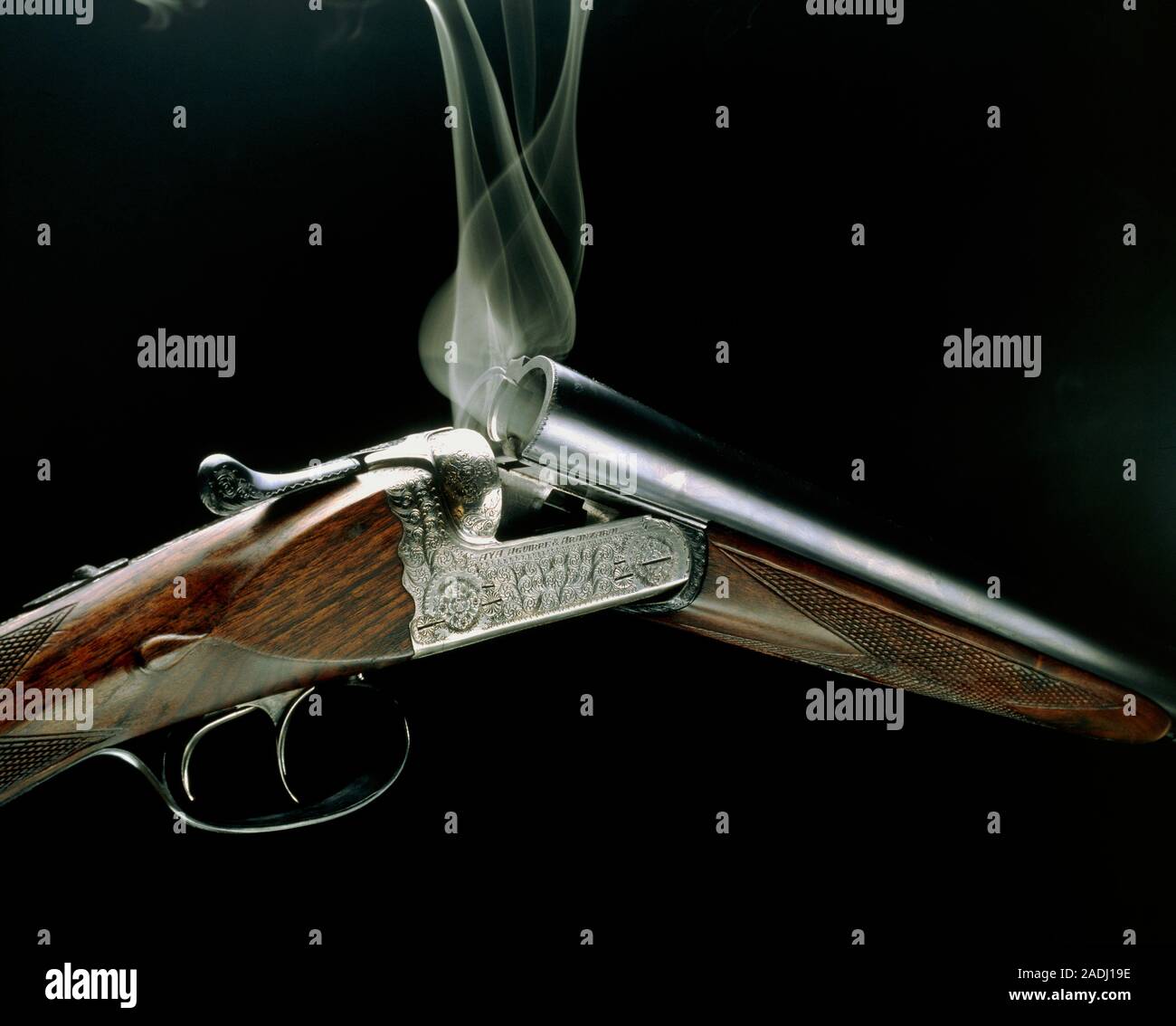 Smoking gun. Smoking chambers of a double- barrelled shotgun Stock ...