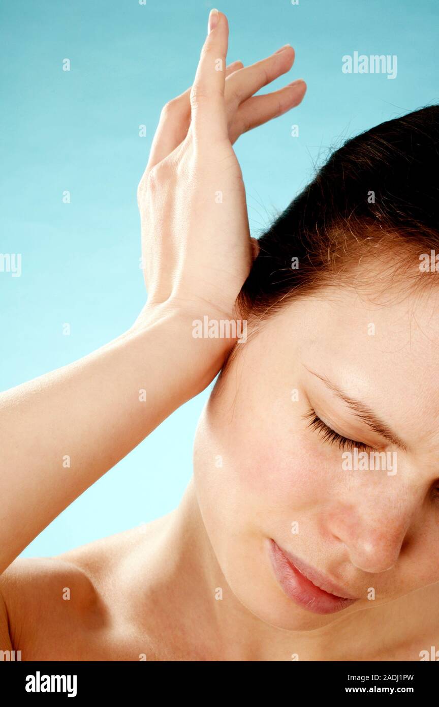 Earache. Woman holding her hand to her painful ear. Earache may ...