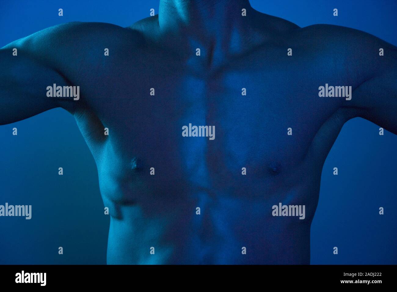 Chest pain. Conceptual image taken in ultraviolet light of a man's ...