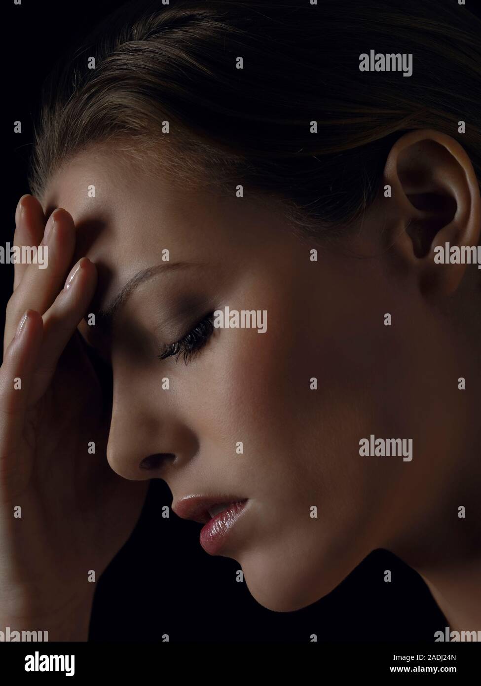 MODEL RELEASED. Headache. Woman with a headache and sore throat Stock ...