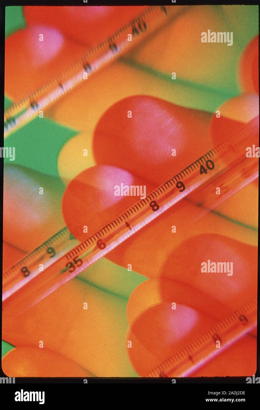 Thermometer. Multiple exposure image of a clinical thermometer with a ...