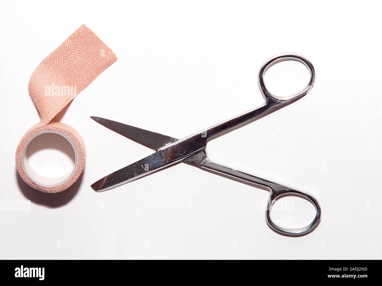 First aid equipment. Roll of sticking plaster and a pair of scissors ...