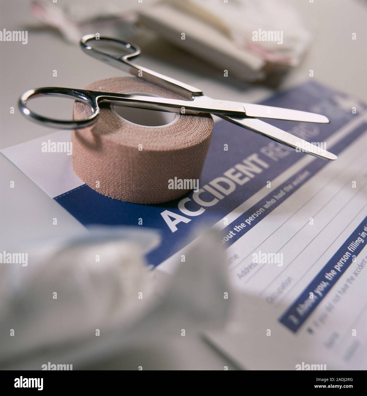 First aid equipment. Scissors and tape used to secure bandages for ...