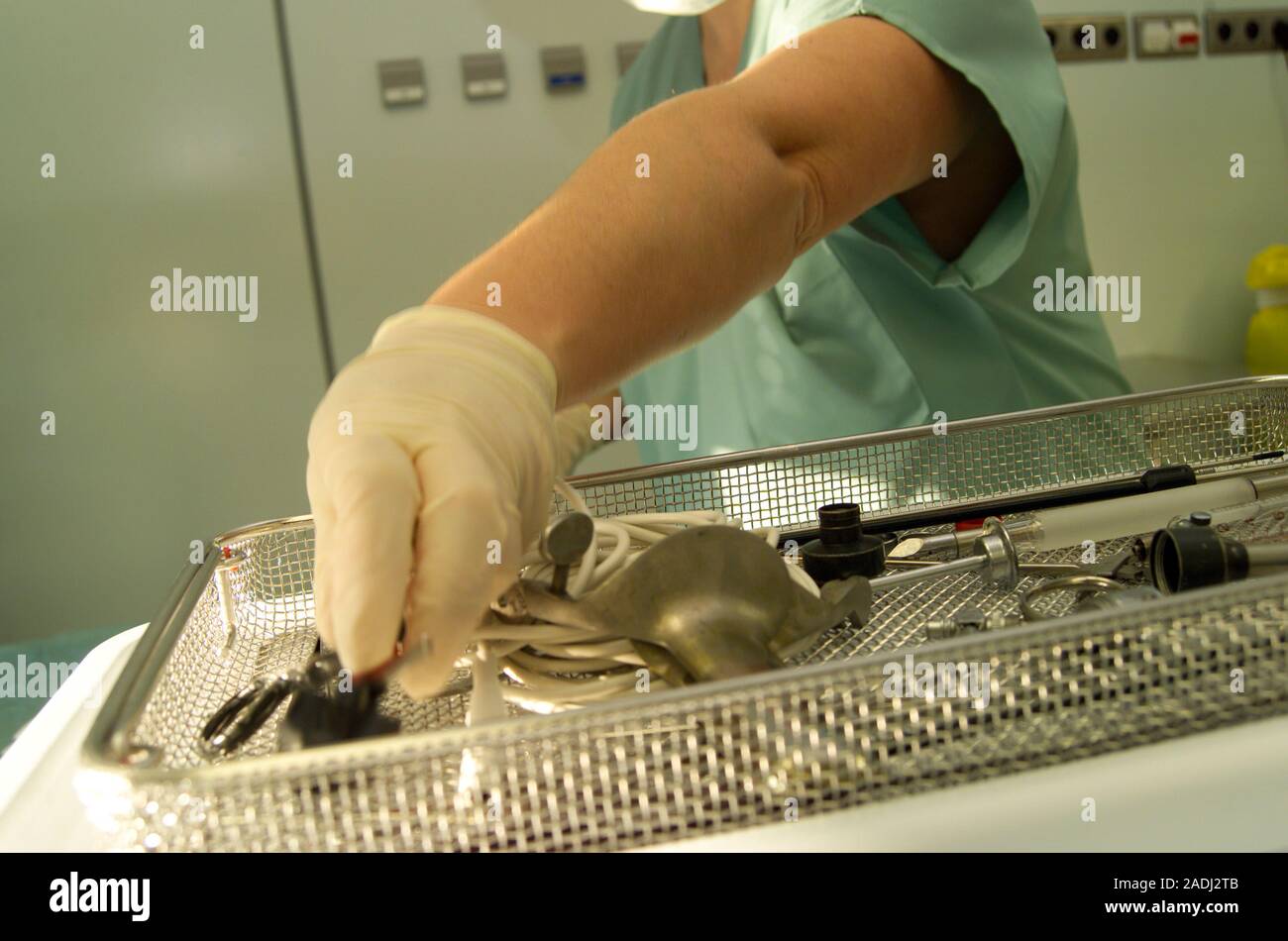 Surgical instruments being placed in a wire rack in an operating ...