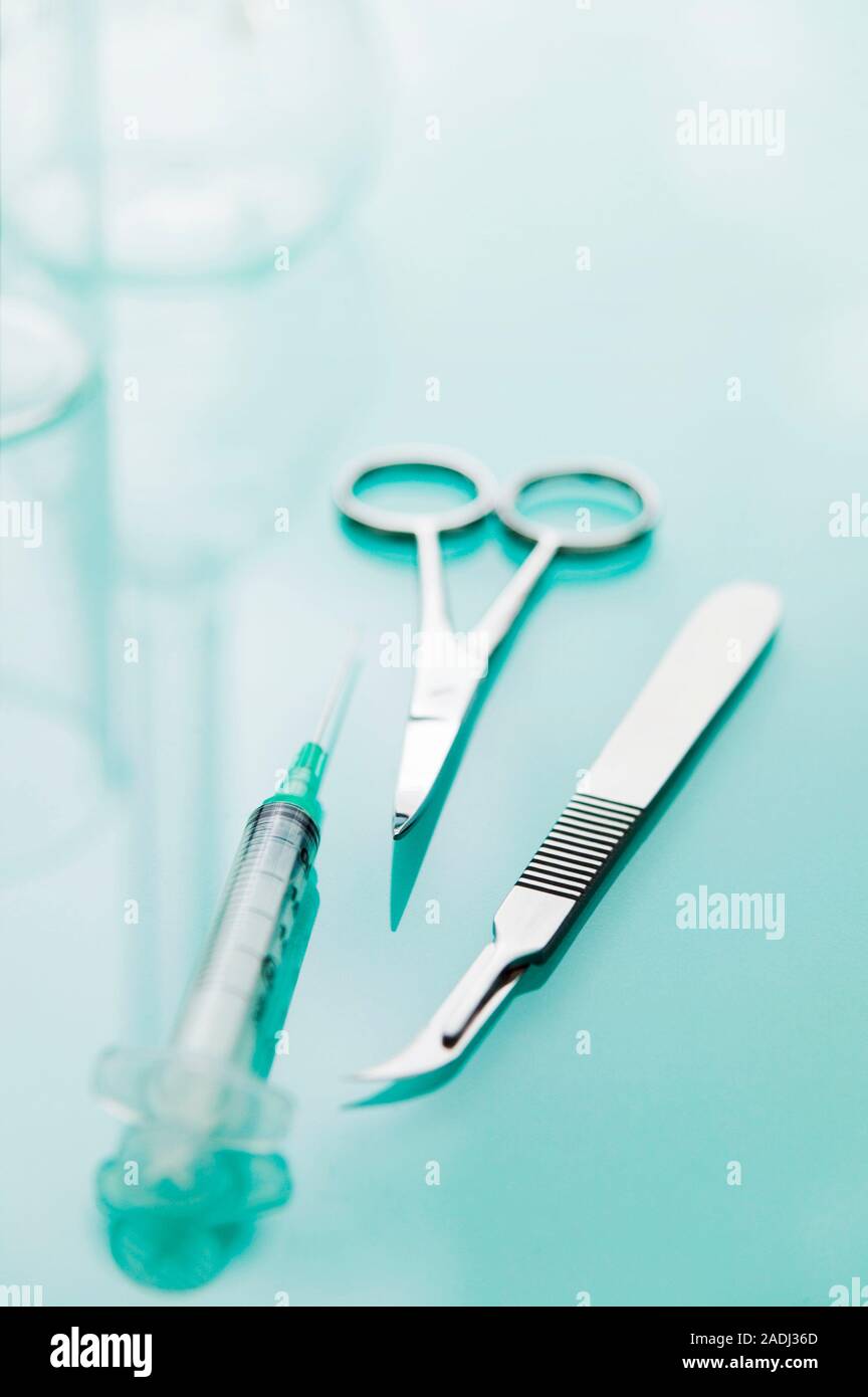 Medical equipment including scissors, a syringe and a scalpel Stock ...