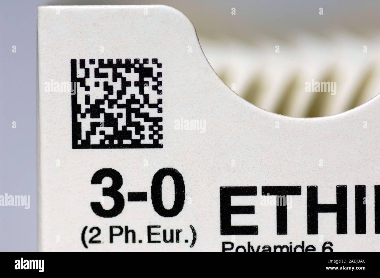 Data matrix barcode (upper left) on a box of medical sutures. A data ...