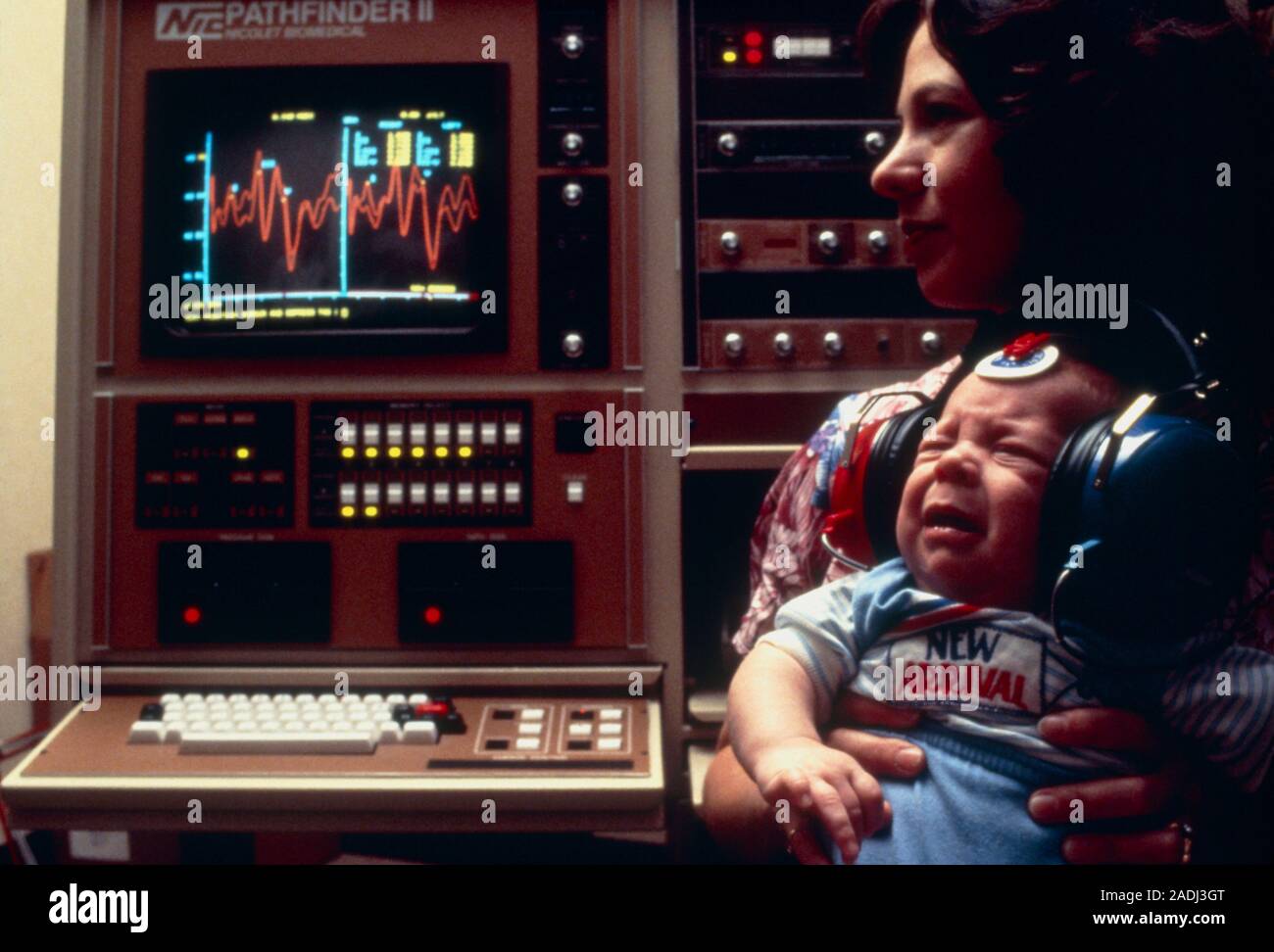 Infant in a U.S. hospital undergoing tests for hearing impairment using ...