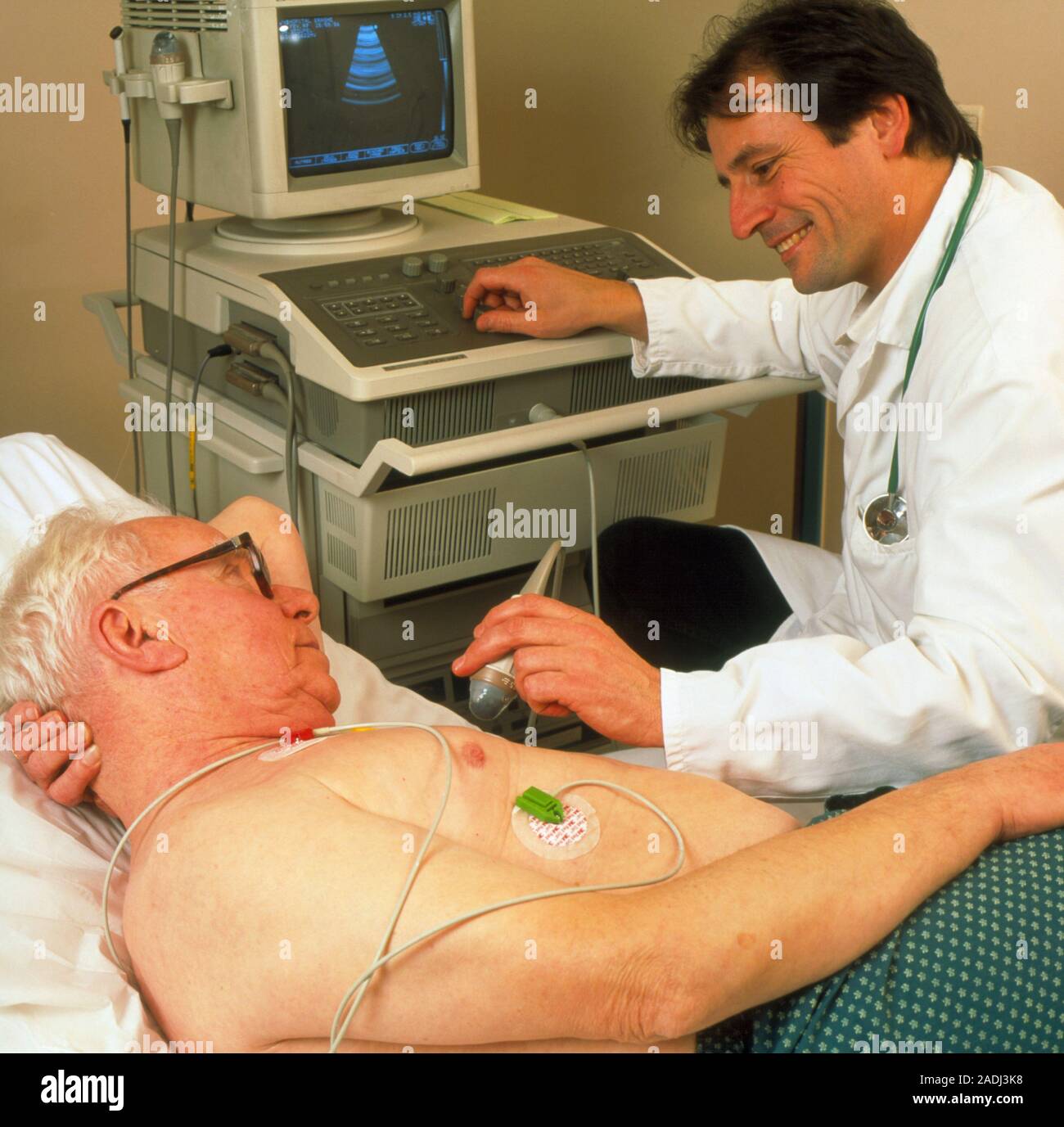 Echocardiography. Doctor carrying out an echocardiography (ultrasound ...