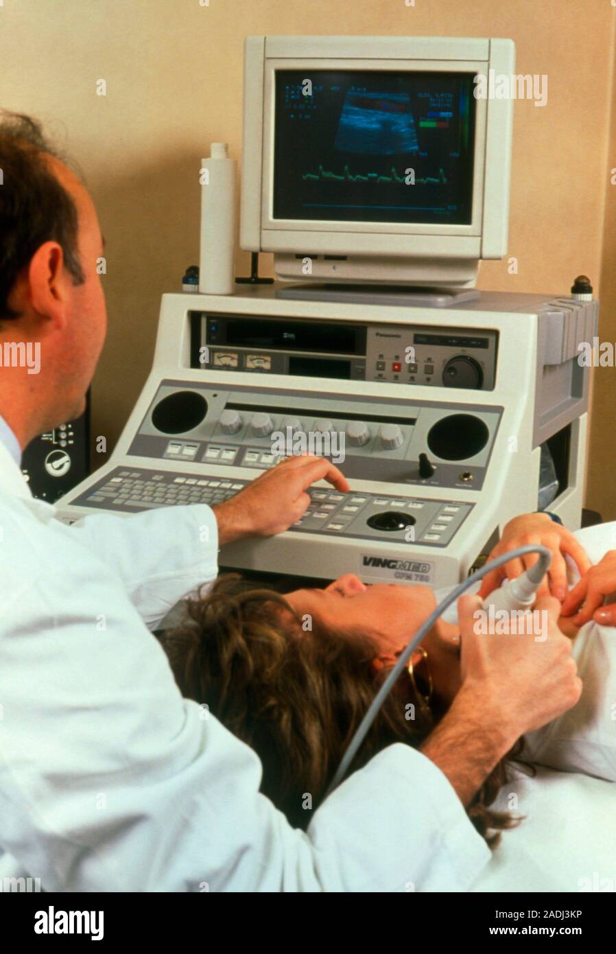 Ultrasound scanning. View of a male doctor using ultrasound scanning to ...