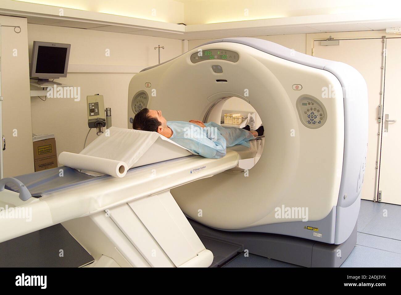 CT scanning. Patient about to have his abdomen scanned by a CT scanner ...