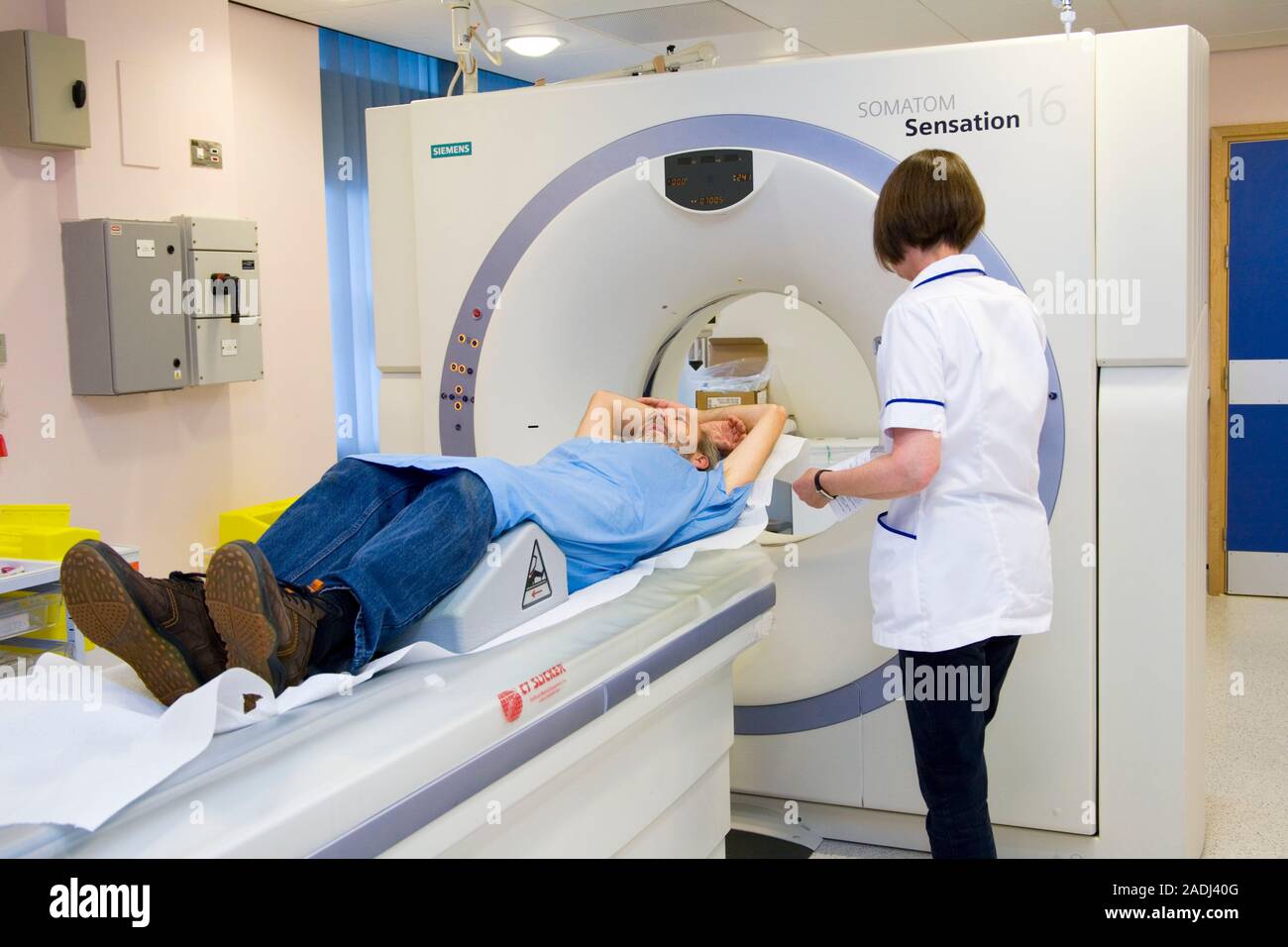 MODEL RELEASED. CT scanning. Patient being aligned for a chest CT scan ...