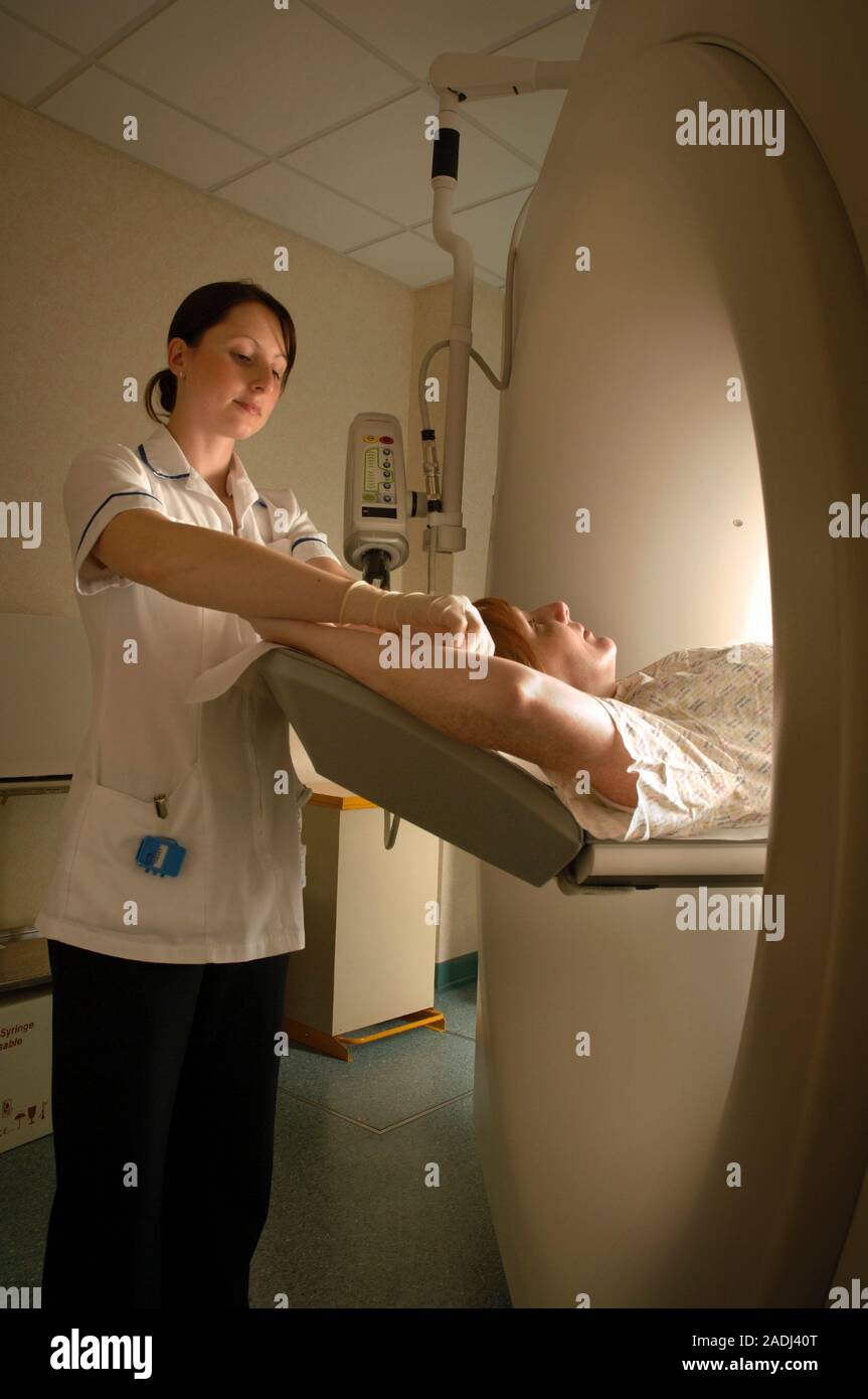 CT scanning. Patient being aligned for a CT scan. Computed tomography ...