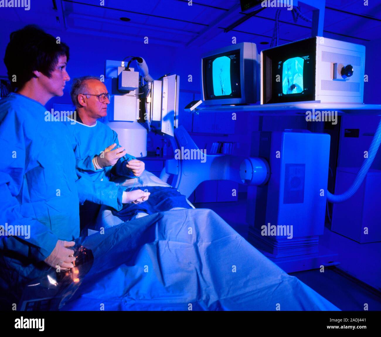 Carotid angiography. Patient undergoing an angiography examination to ...