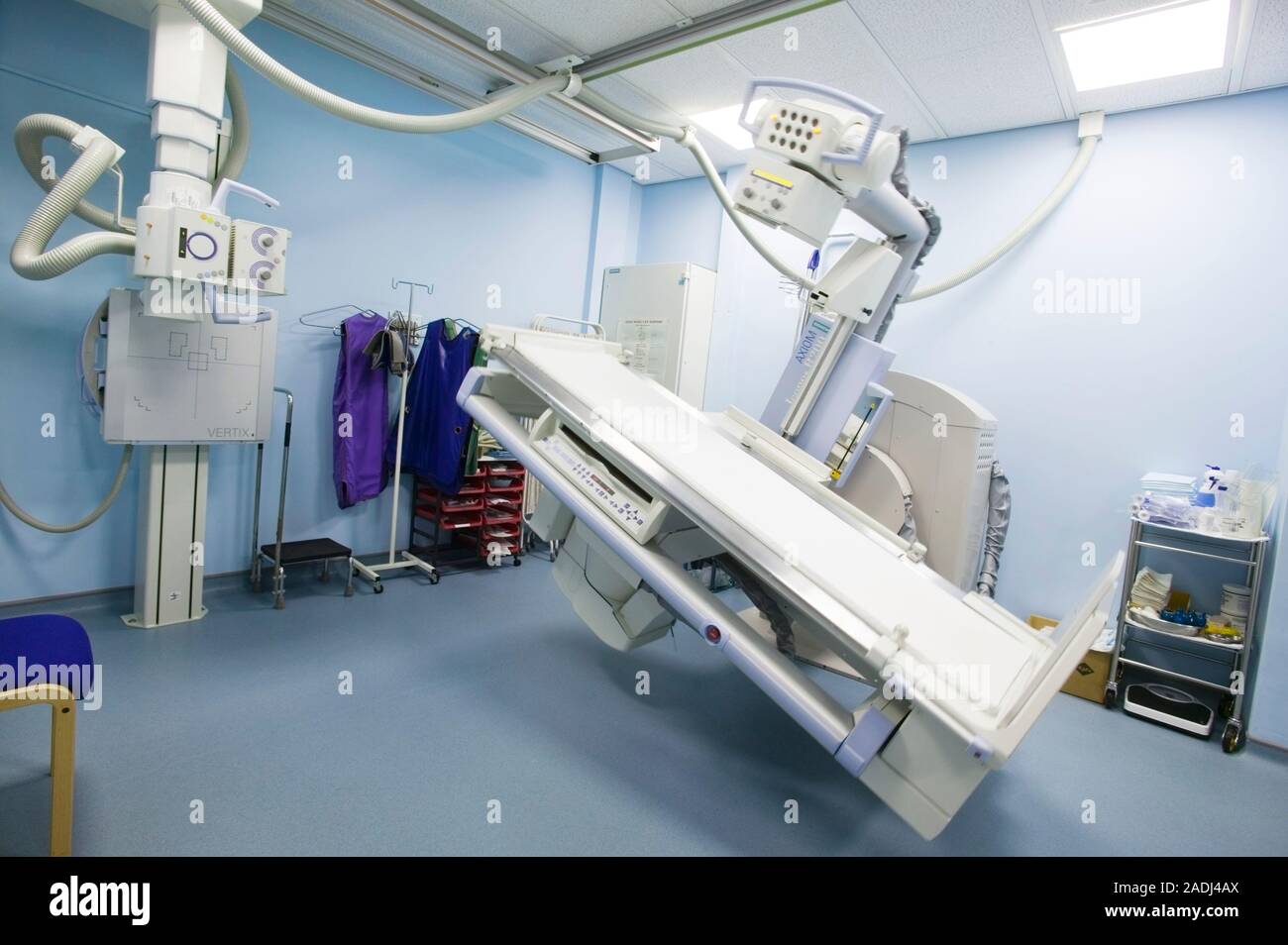 X-ray machines in the radiology department of a hospital. At left is a ...