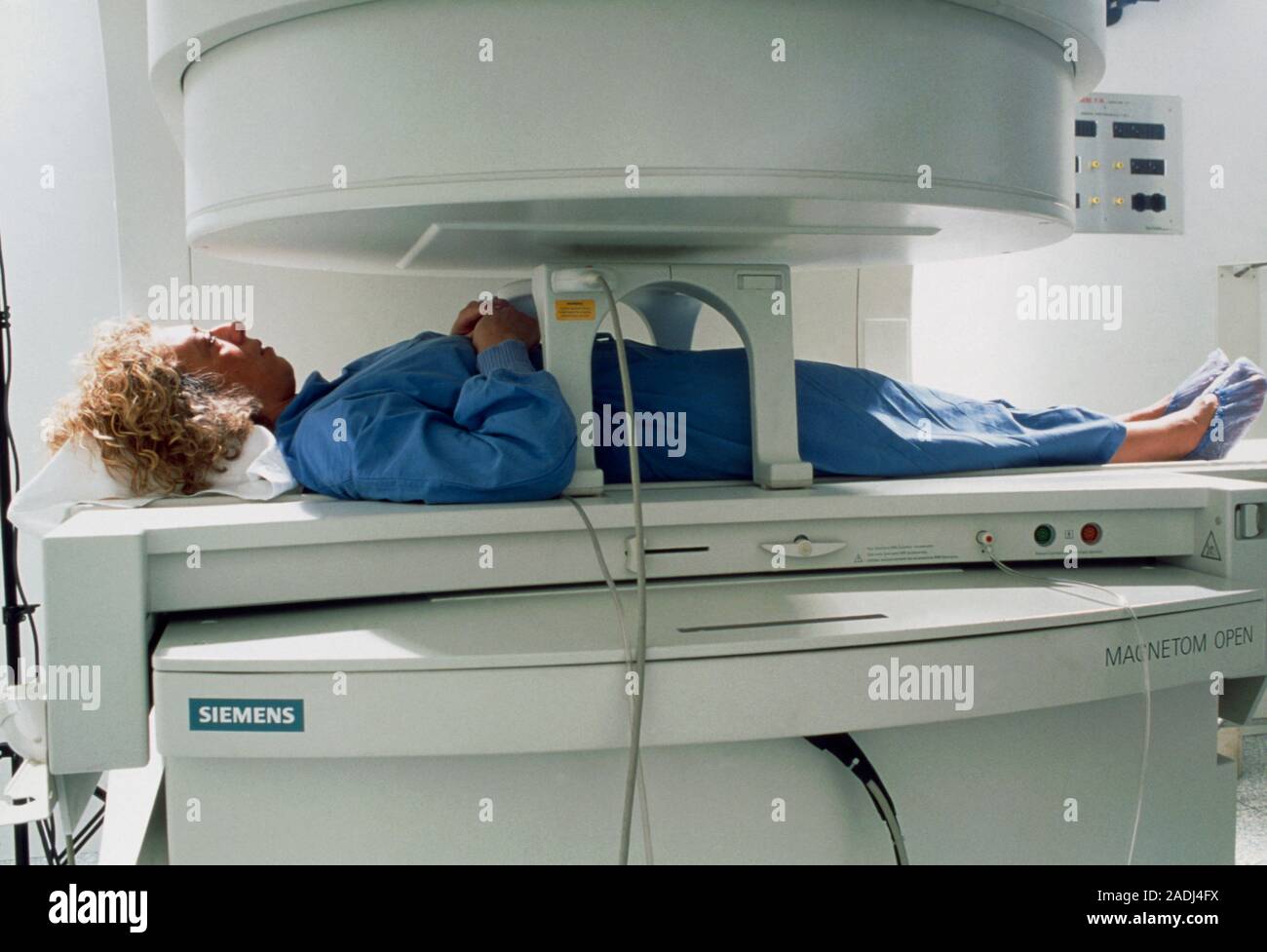 MRI scanner. View of a woman undergoing a scan in a magnetic resonance ...
