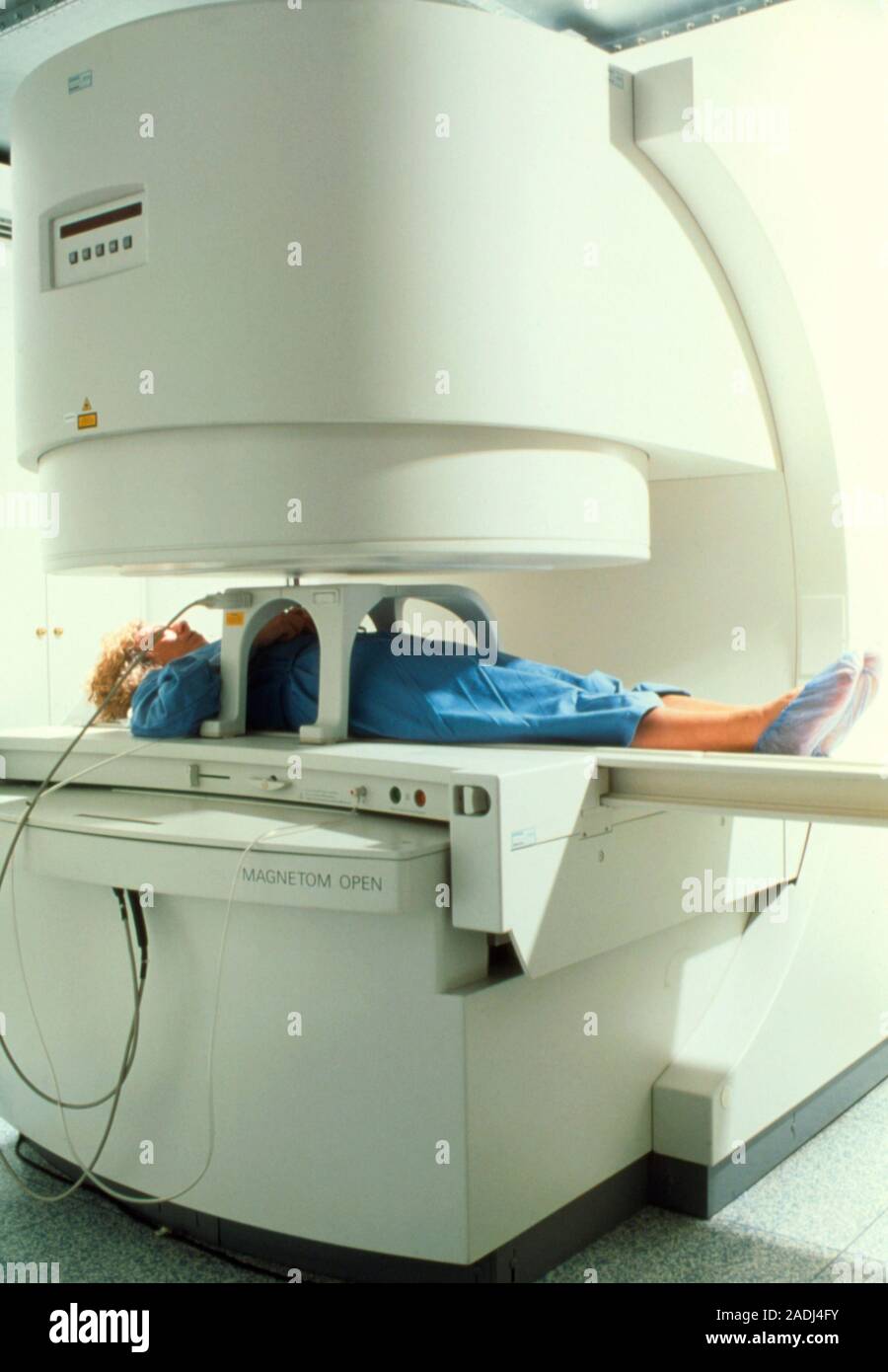 MRI scanner. View of a woman undergoing a scan in a magnetic resonance ...
