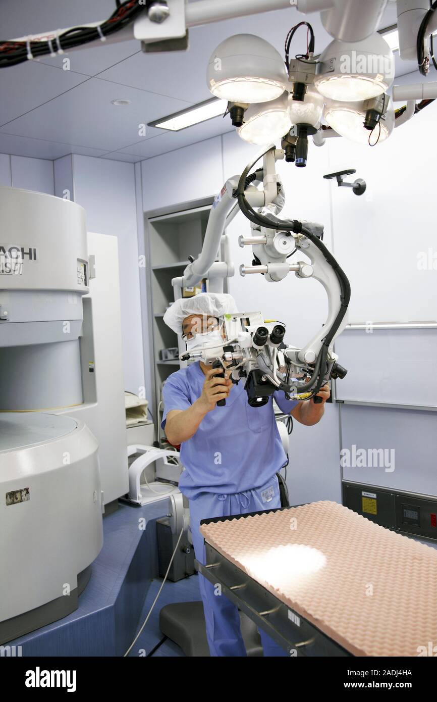 MRI surgery equipment. Surgeon adjusting camera equipment next to a ...