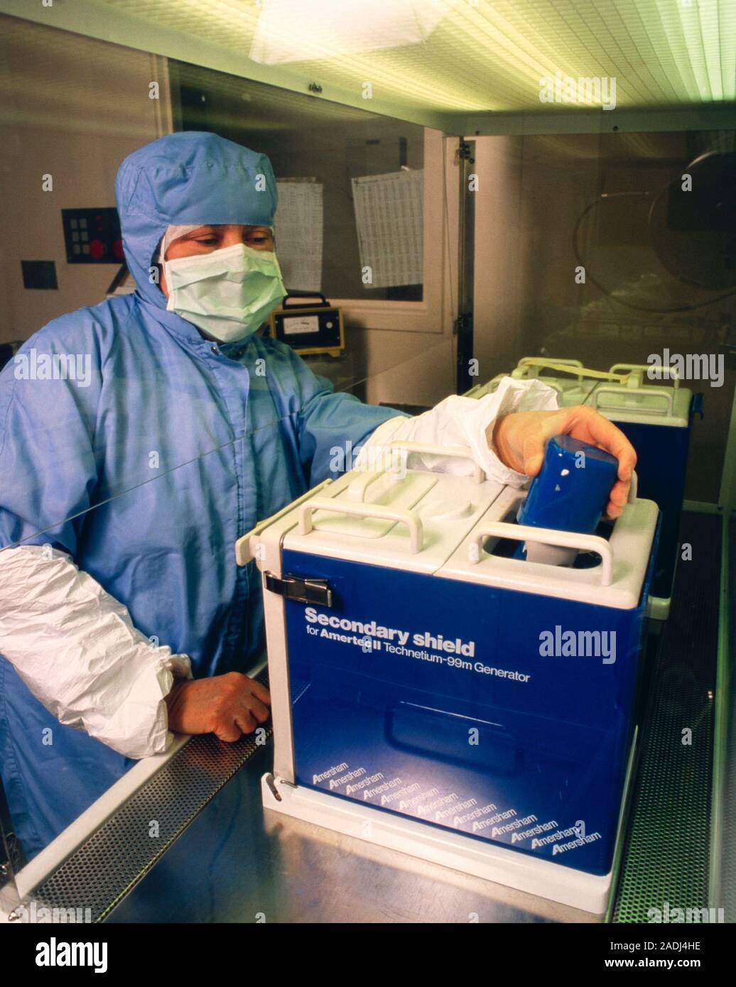 Medical physicist unloading a technetium-99m (Tc-99m) source from an ...