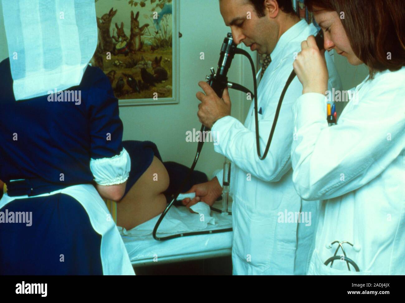 Paediatric colonoscopy: doctor using a flexible, illuminated fibre ...