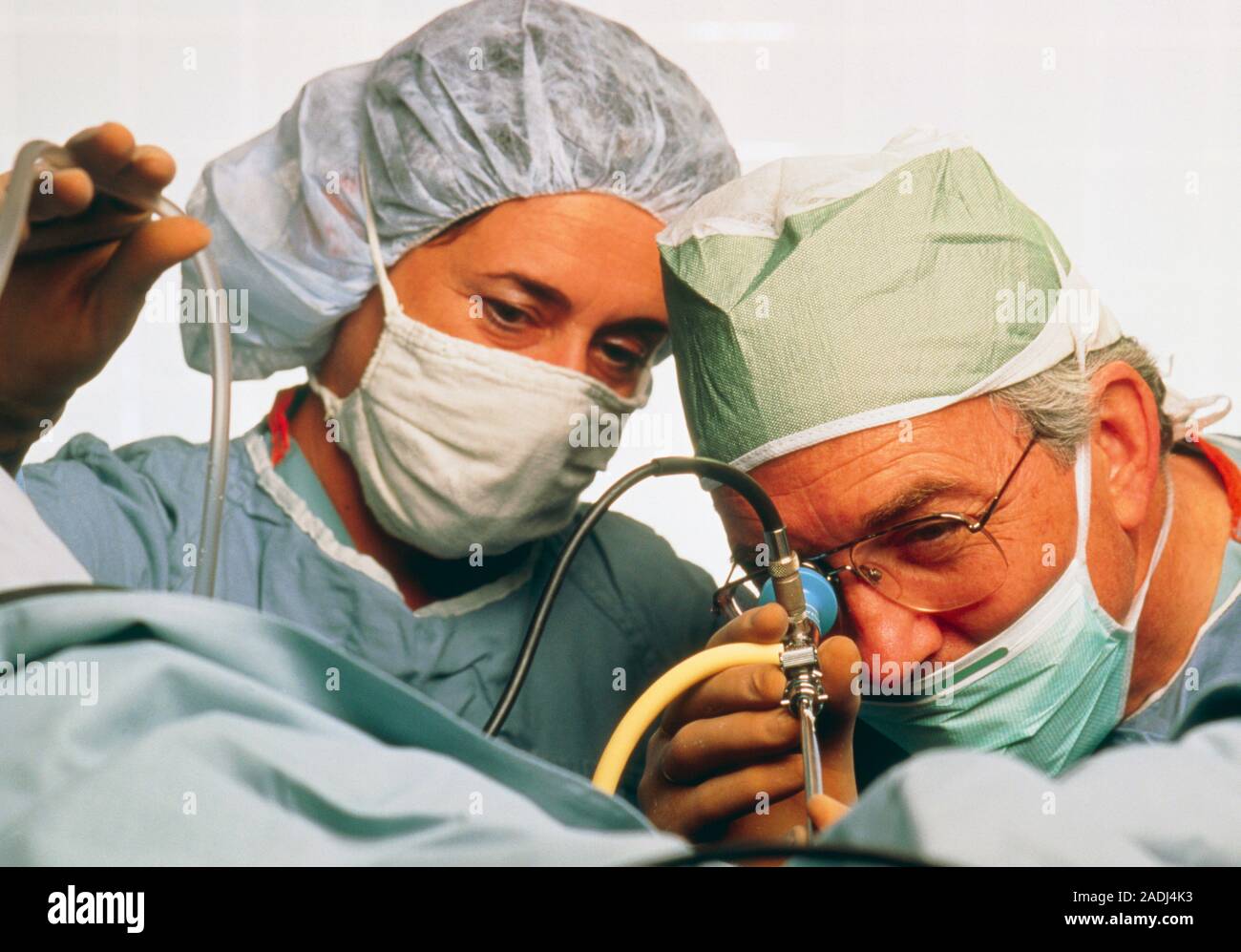 Surgeon using a rigid-type endoscope, an instrument that allows him to ...